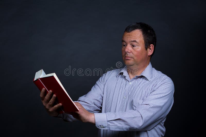 Needing reading glasses stock image. Image of holding - 53013539