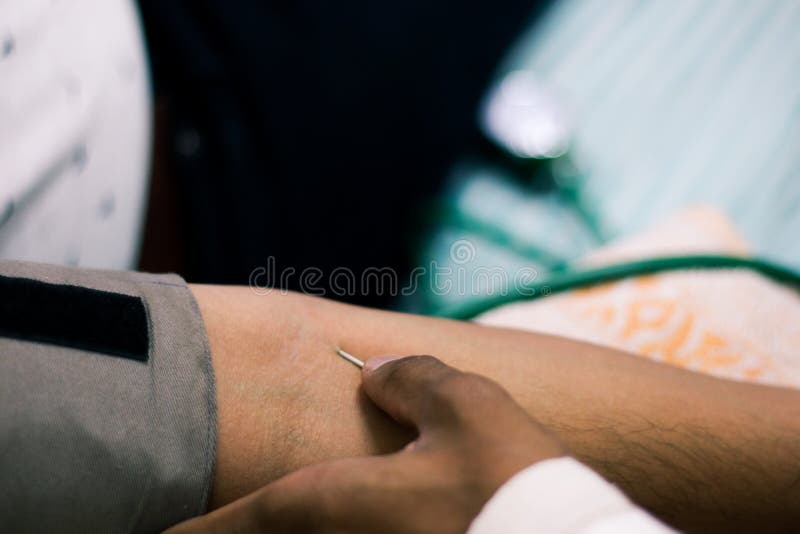 Needle for Blood Collection Inserted in Arm of Patient by Attendant ...