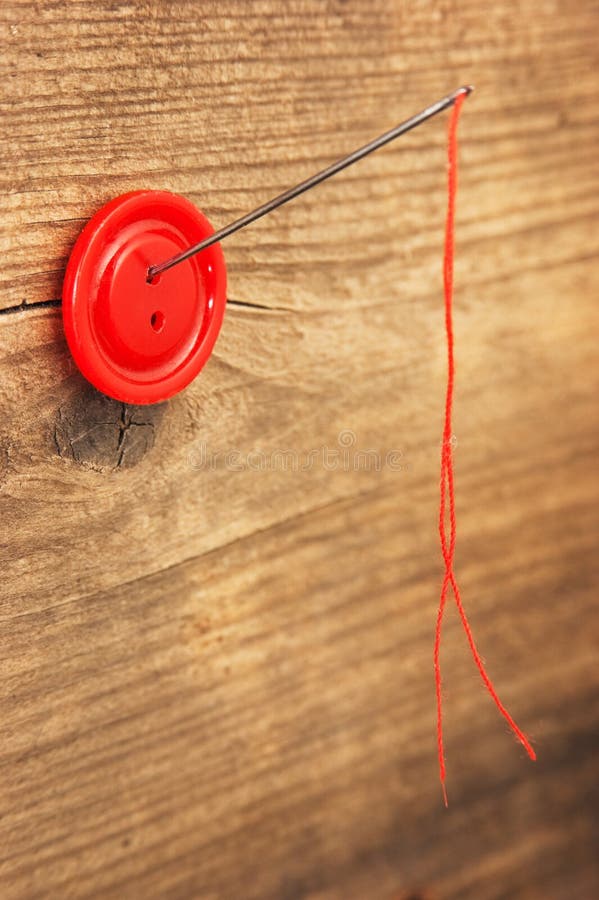 Needle and a button stock photo. Image of button, fiber - 133552796