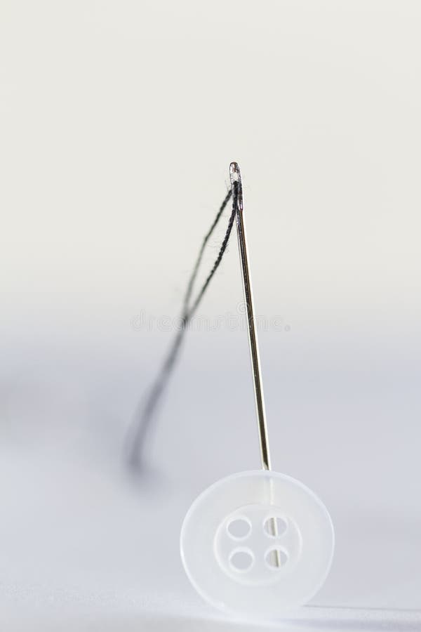 Needle, button and string stock photo. Image of blue - 44347092