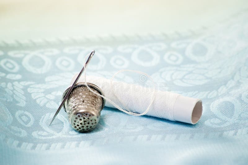 Needle cotton and thimble stock image. Image of needlework - 12573293