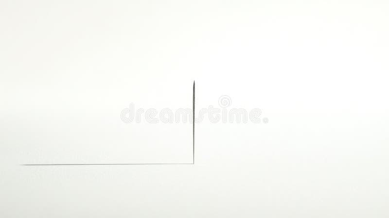 Needle Creating a Hole in a White Paper Background Stock Photo - Image ...