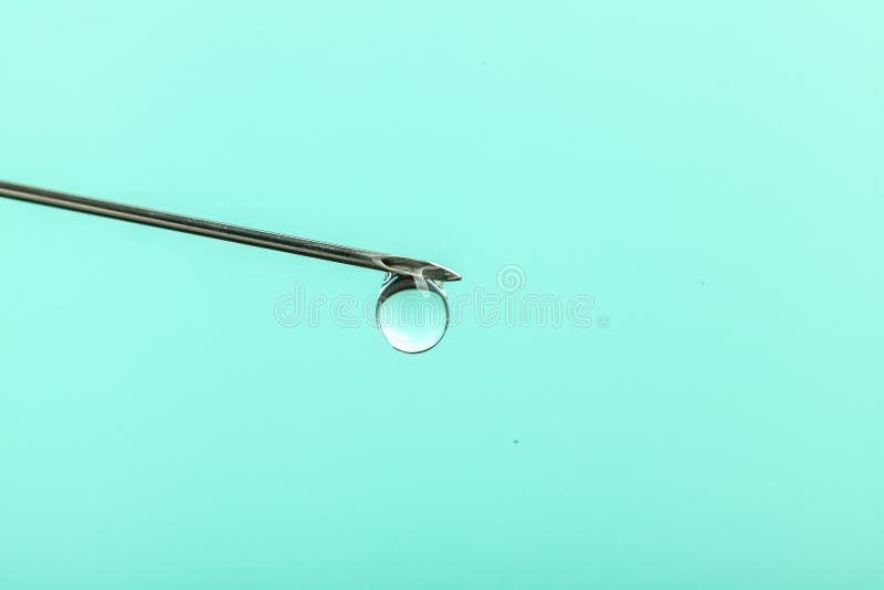 Needle With A Drop And A Smile On Yellow Background. Drugs From Syringe ...