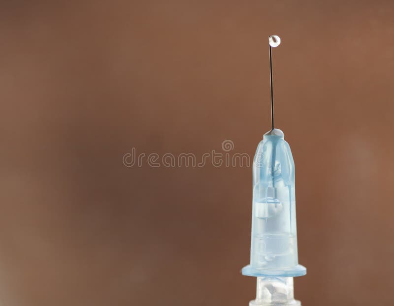 Needle with Droplet on Brick Colored Background Stock Image - Image of ...