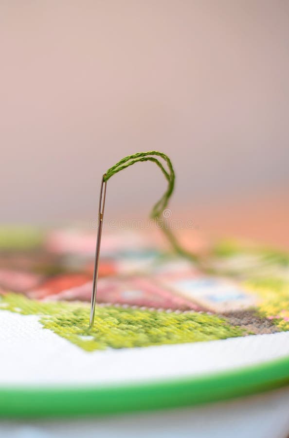 A needle with green thread stock image. Image of macro - 84705341