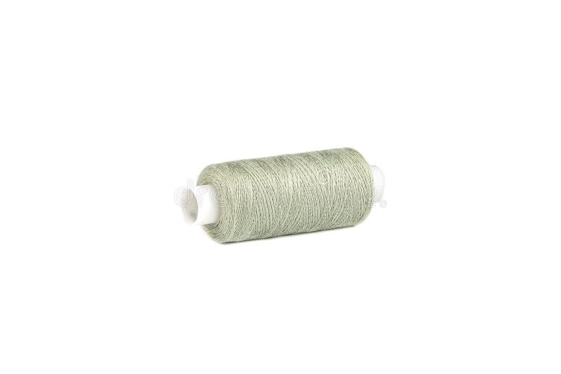 The Needle is Inserted into a Spool of Beryl Green Thread. the Thread ...