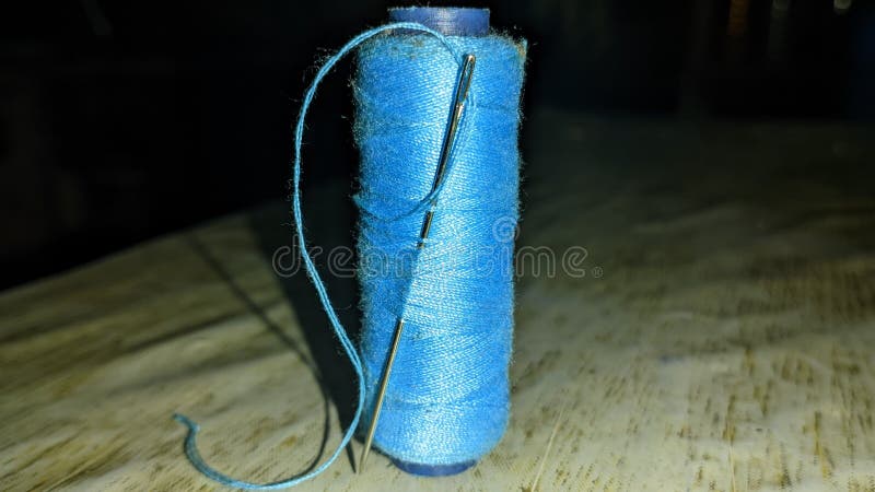 The Needle is in the Middle of the Ball of Thread 3 Stock Image - Image ...