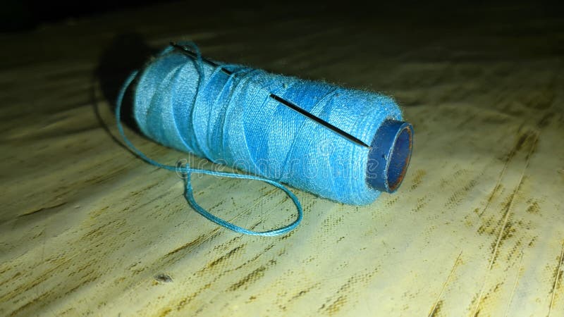 The Needle is in the Middle of the Ball of Thread 1 Stock Photo - Image ...