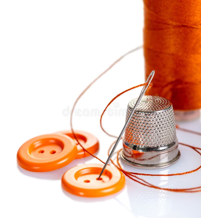 Needle with Orange Thread and Buttons Stock Image - Image of closeup ...