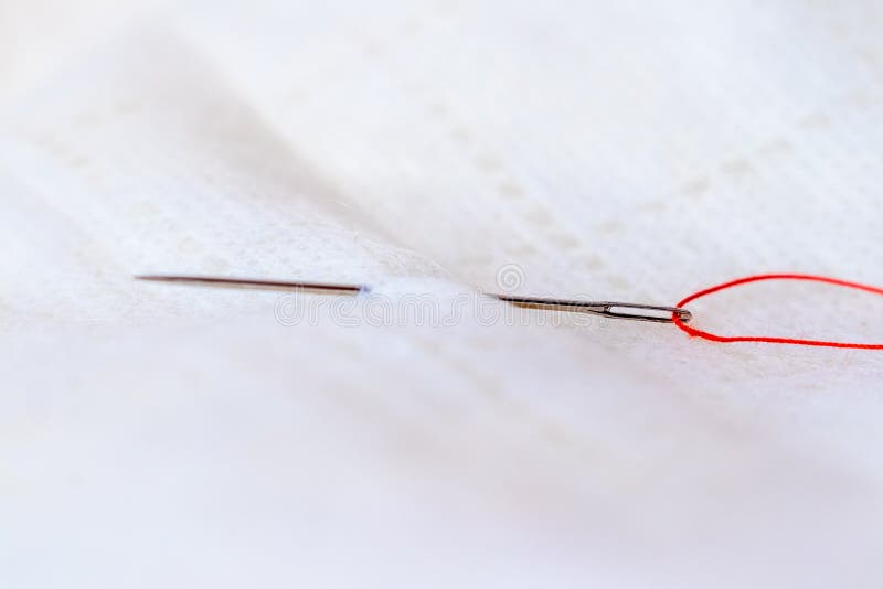 Needle with Red Thread on Light Fabric Background_ Stock Photo - Image ...