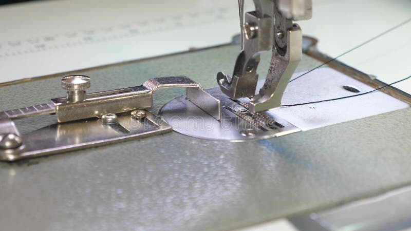 Needle of the Sewing Machine in Motion, Close-up. Needle of the Sewing ...