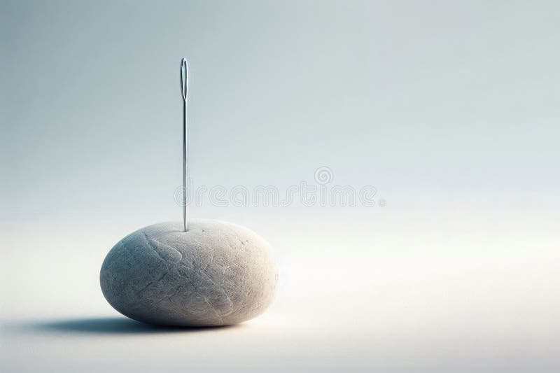A Needle Stuck in a Smooth Stone. Space for Text. Stock Image - Image ...
