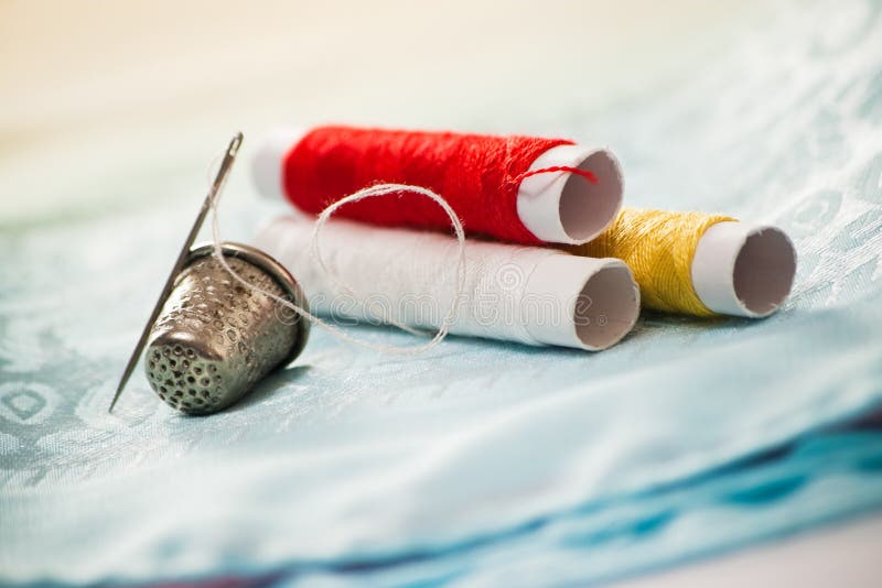 Needle thimble and cotton stock image. Image of macro - 10629075
