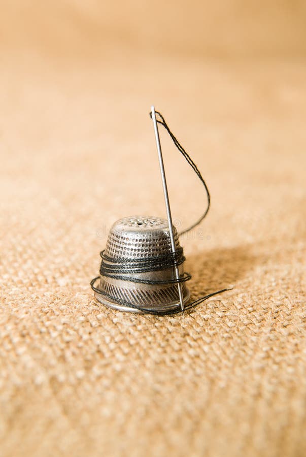 Needle and Thimble on the Old Cloth Stock Photo - Image of needlewoman ...
