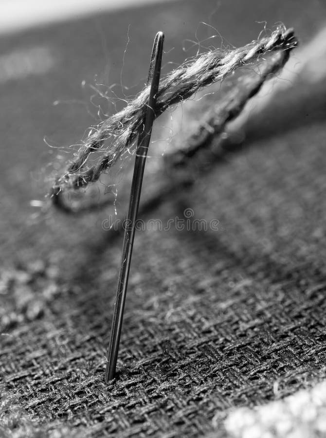 Needle and Thread on the Background of Embroidery Stock Image - Image ...
