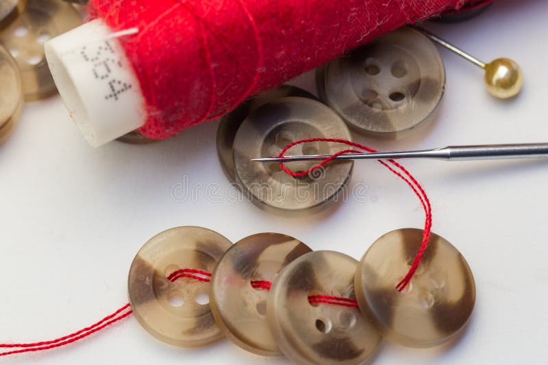 Needle with Thread and Button Isolated on White Stock Photo - Image of ...