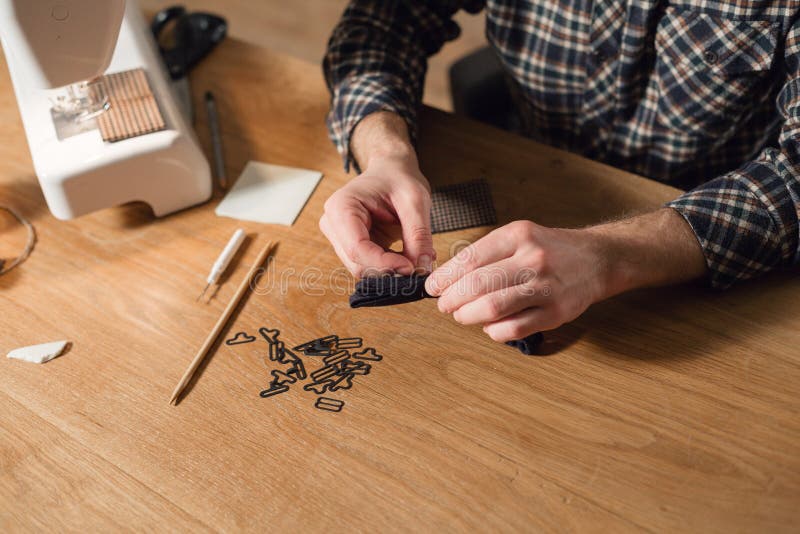 With a Needle and Thread in Hand. Good Looking Young Man Working As a ...