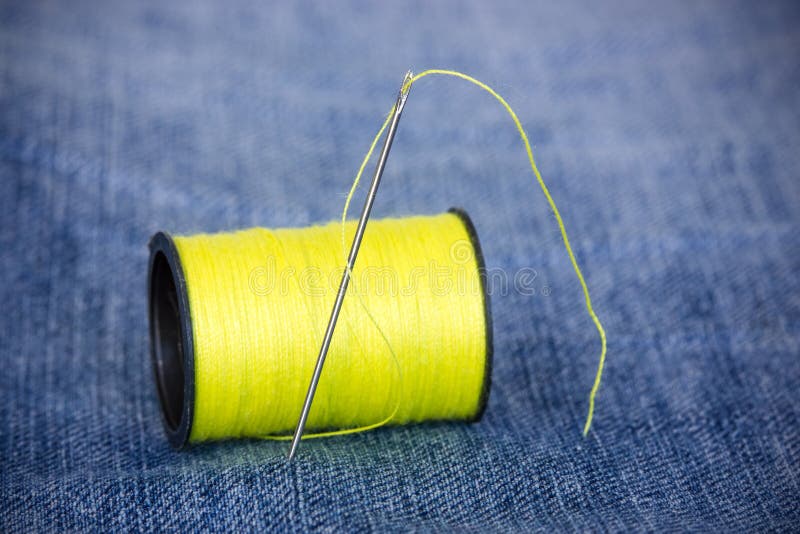 Needle with Thread on Jeans Material Stock Photo - Image of clothing ...