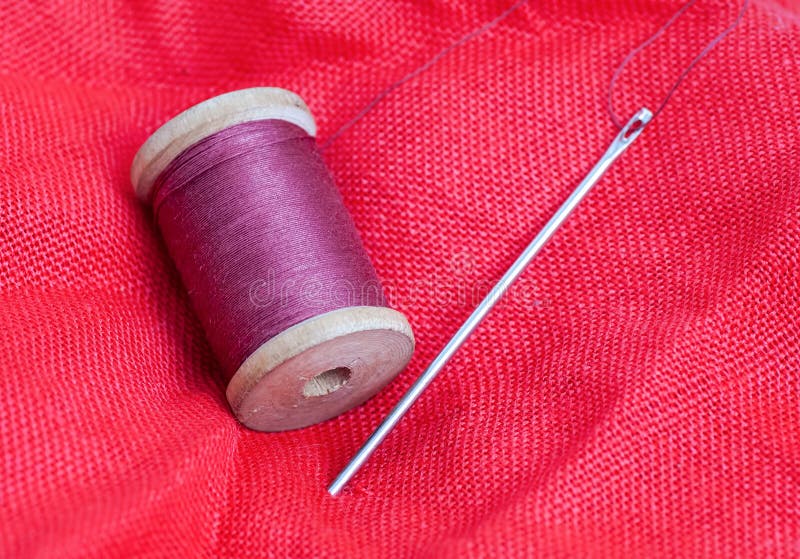 Needle and Thread on a Red Background Stock Photo - Image of ...
