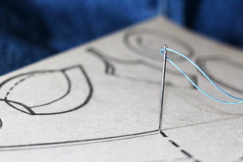 Needle and Thread on Sewing Pattern Stock Photo - Image of designer ...