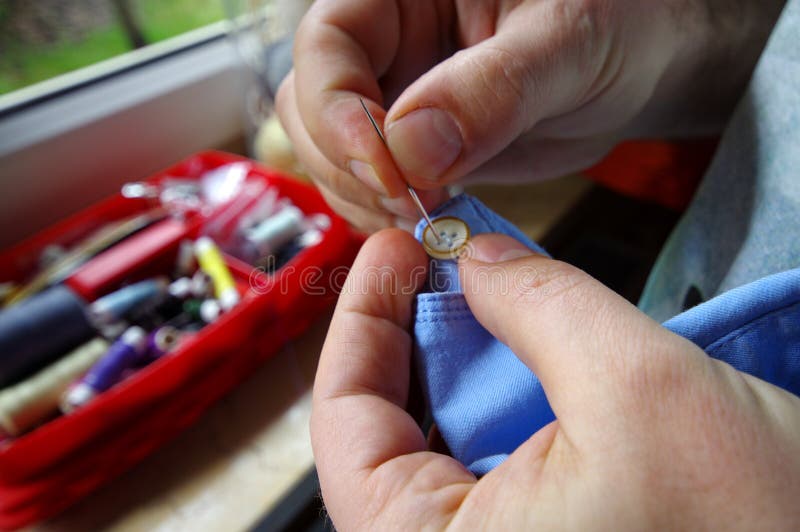 Needle and Thread in the Tailor Hand Stock Photo - Image of person ...