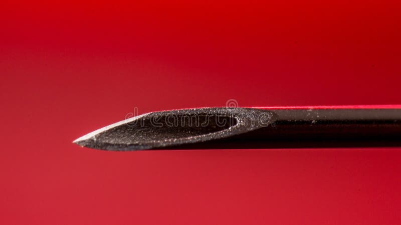 Needle Tip of an Injection Syringe, on Red Background Stock Image ...