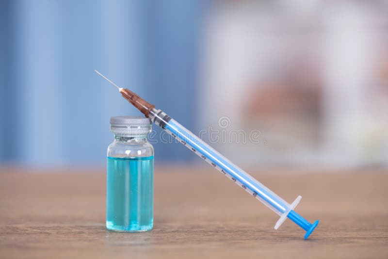 Needle tube and a vaccine stock photo. Image of life - 253697196