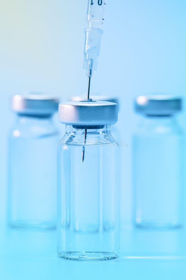 Vaccine Vial with Intramuscular Needle Stock Photo - Image of ...