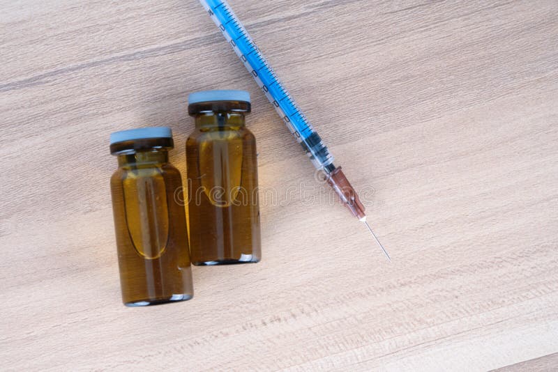 Needles and Bottles on Table Stock Image - Image of vaccine, tube ...
