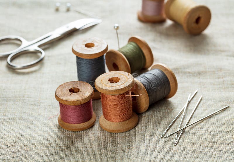 Needles with Sewing Thread and Scissors on a Canvas Stock Image - Image ...