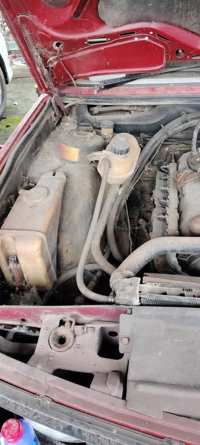 An Old Car Engine that Has Been Neglected and is Starting To Rust and ...