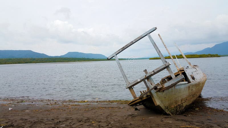 A Neglected Boat on the Gilimanuk Bay Stock Photo - Image of channel ...