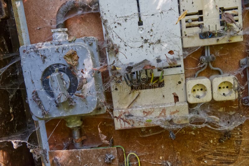 Neglected Electrical Panel with Cobwebs and Debris Stock Image - Image ...