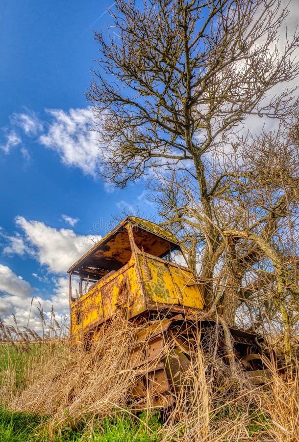 Neglected Old Tractor on the Edge of a Field. Stock Image - Image of ...