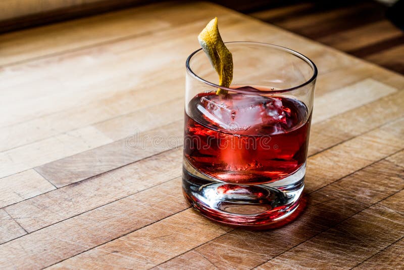 Negroni Cocktail with Lemon Peel and Ice Stock Image - Image of dark ...