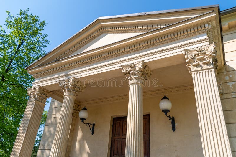 A Neoclassical Building Entrance with Corinthian Columns and a ...