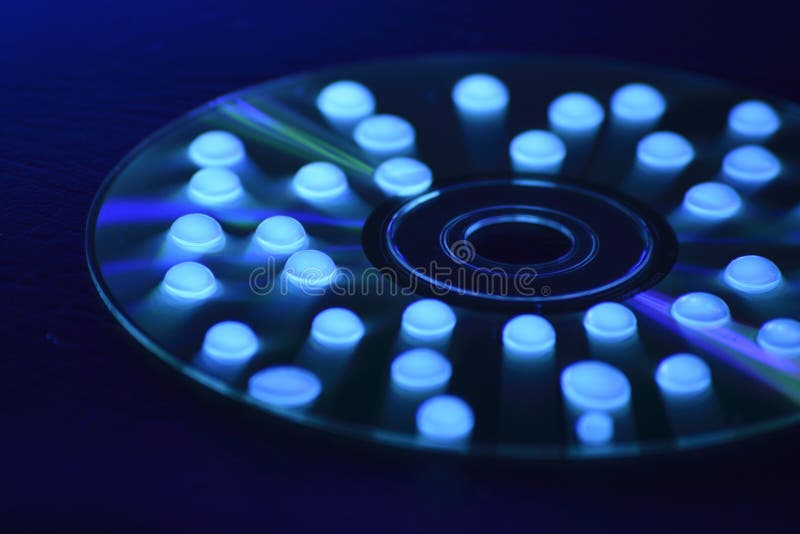 Neon blue drops on disc stock image. Image of disc, electronics - 251229193