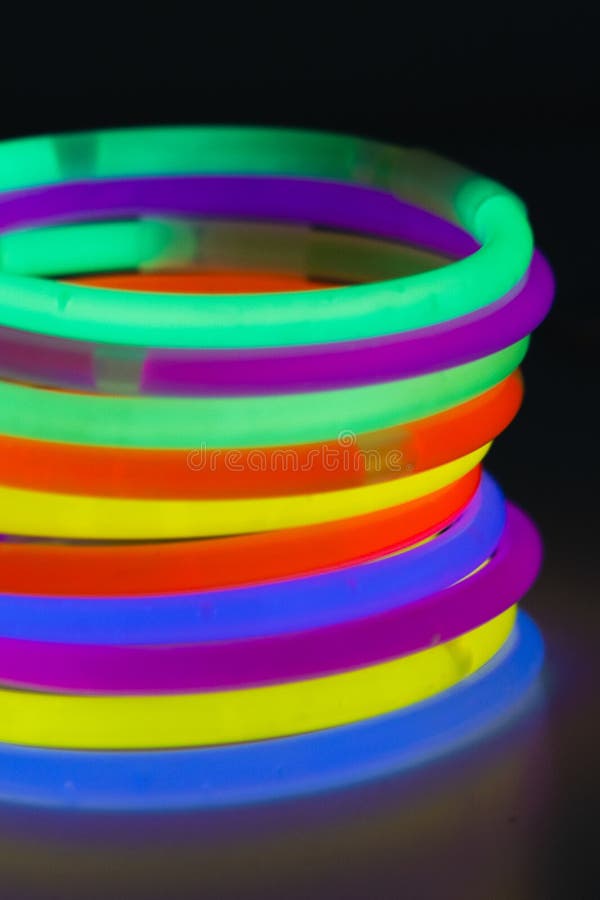 Neon Bracelets Glow Sticks in the Dark Stock Image - Image of glowing ...