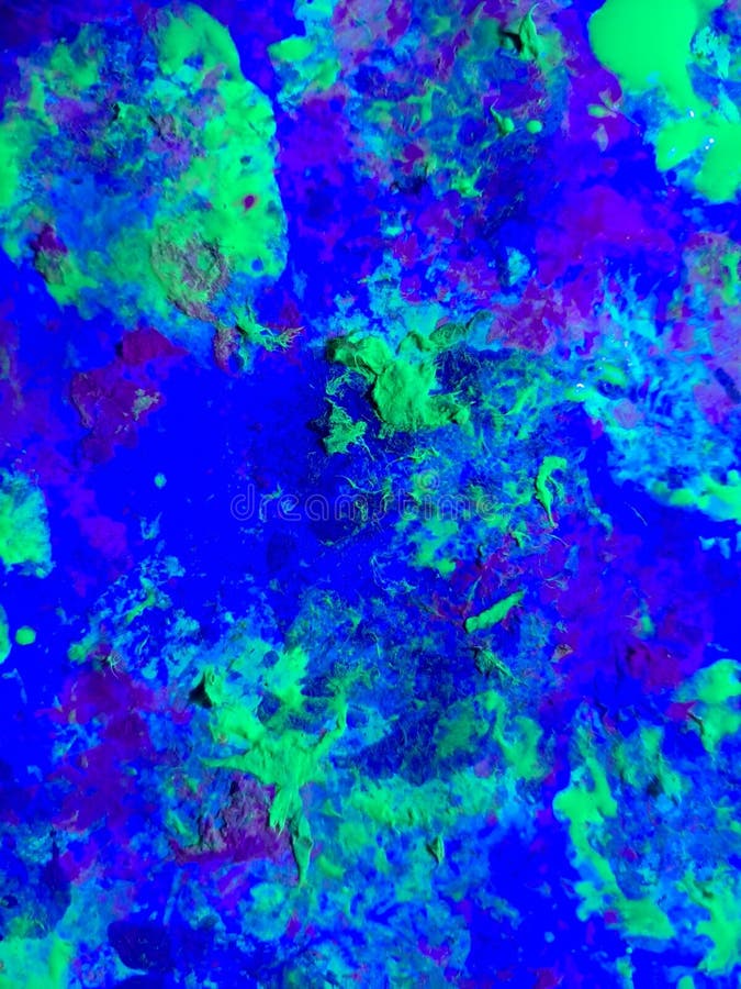 Neon Color Paint Splatter Under a Black Light Glowing Stock Photo ...