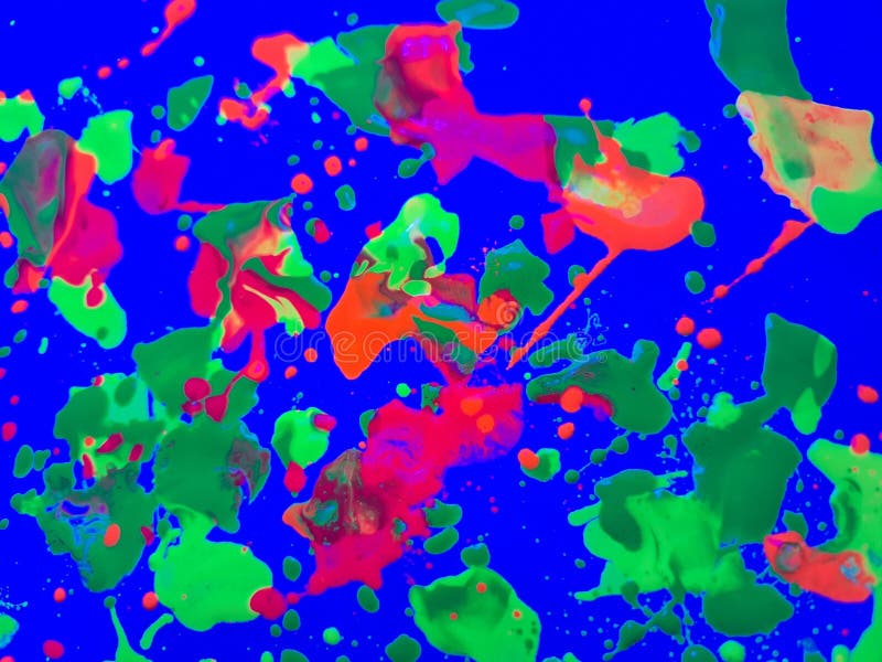 Neon Color Paint Splatter Under a Black Light Glowing Stock Photo ...