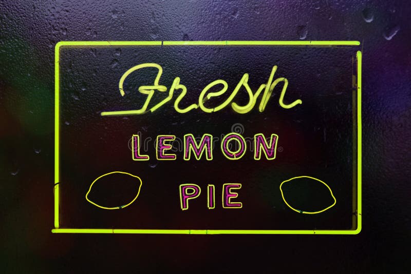 Neon Fresh Lemon Pie Sign in Rainy Window of Cafe Stock Image - Image ...