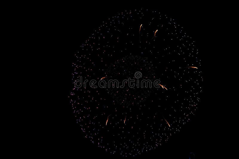 Neon and Golden Sparks of Exploding Fireworks and Salutes in the Dark ...