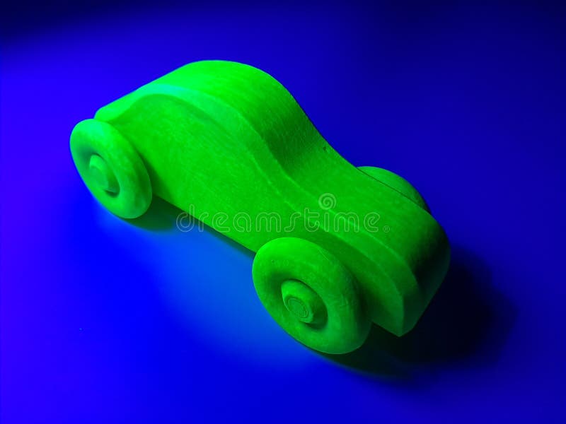 Neon Green Toy Car Under a Black Light Glowing Stock Photo - Image of ...