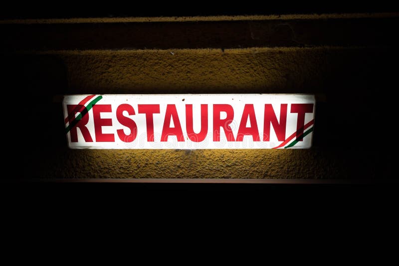 A Restaurant Text Sign on Facade Building City Street Storefront Stock ...