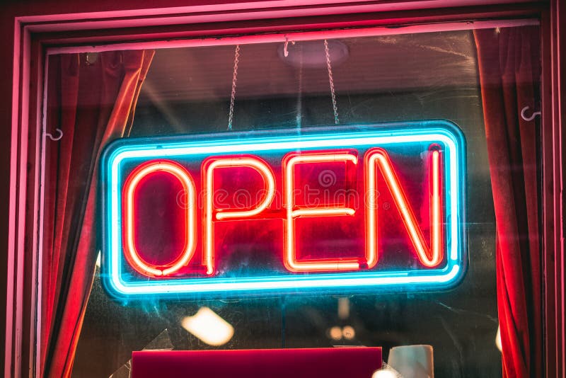 Bright Neon Open Sign Hanging in a Shop Window Stock Photo - Image of ...