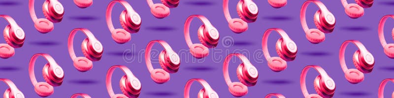Neon Pink Metallic Wireless Headphones in the Air on Violet Background ...