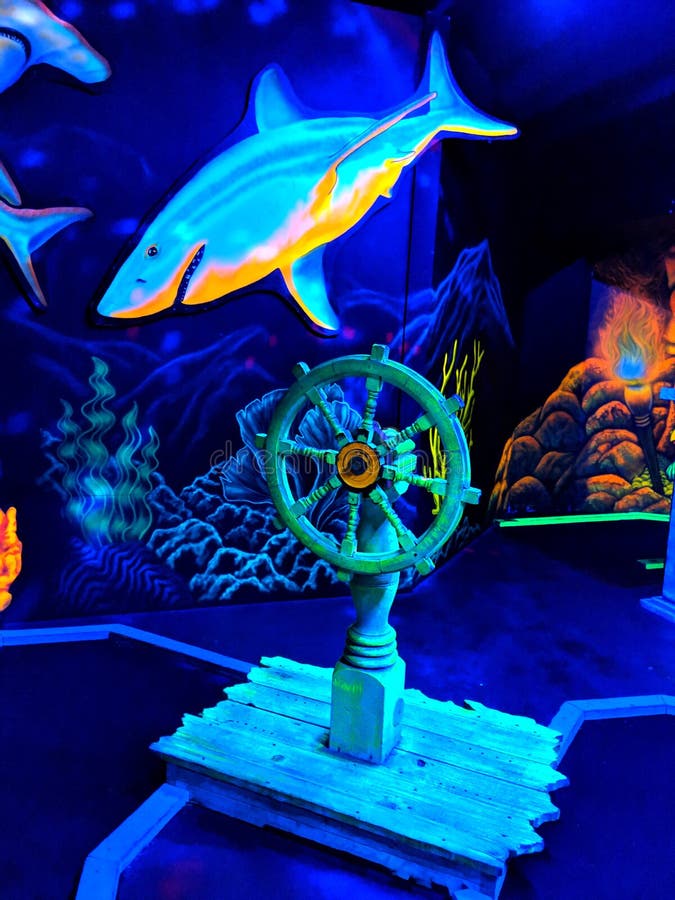 Neon Pirate Ship and Shark Mini Golf Course Stock Image - Image of ...