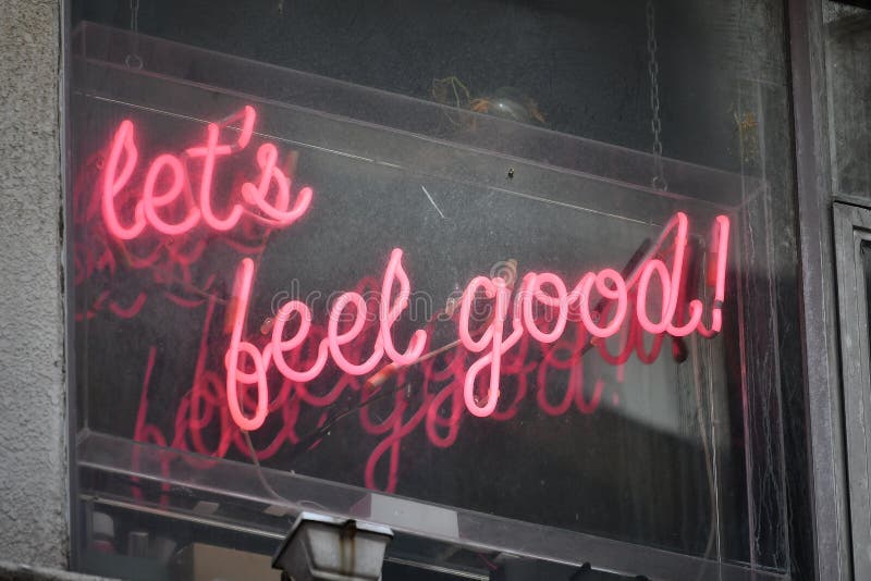 Neon Sign Let& X27;s Feel Good in Red Stock Image - Image of reflection ...
