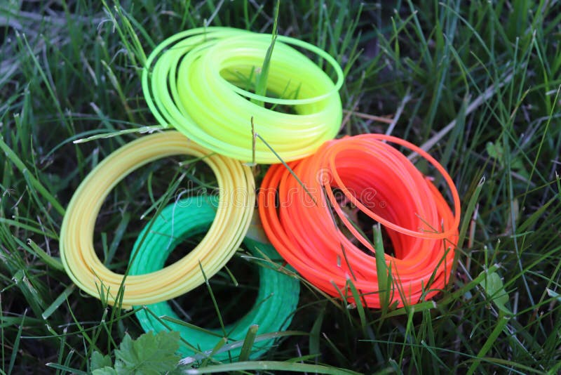 Neon Strings for Grass Trimmer on the Grass Stock Image - Image of ...