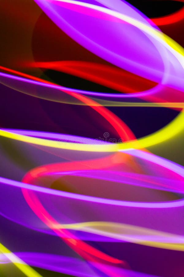 Neon Wavy Rainbow Swirls and Lines on Black Background Stock Photo ...